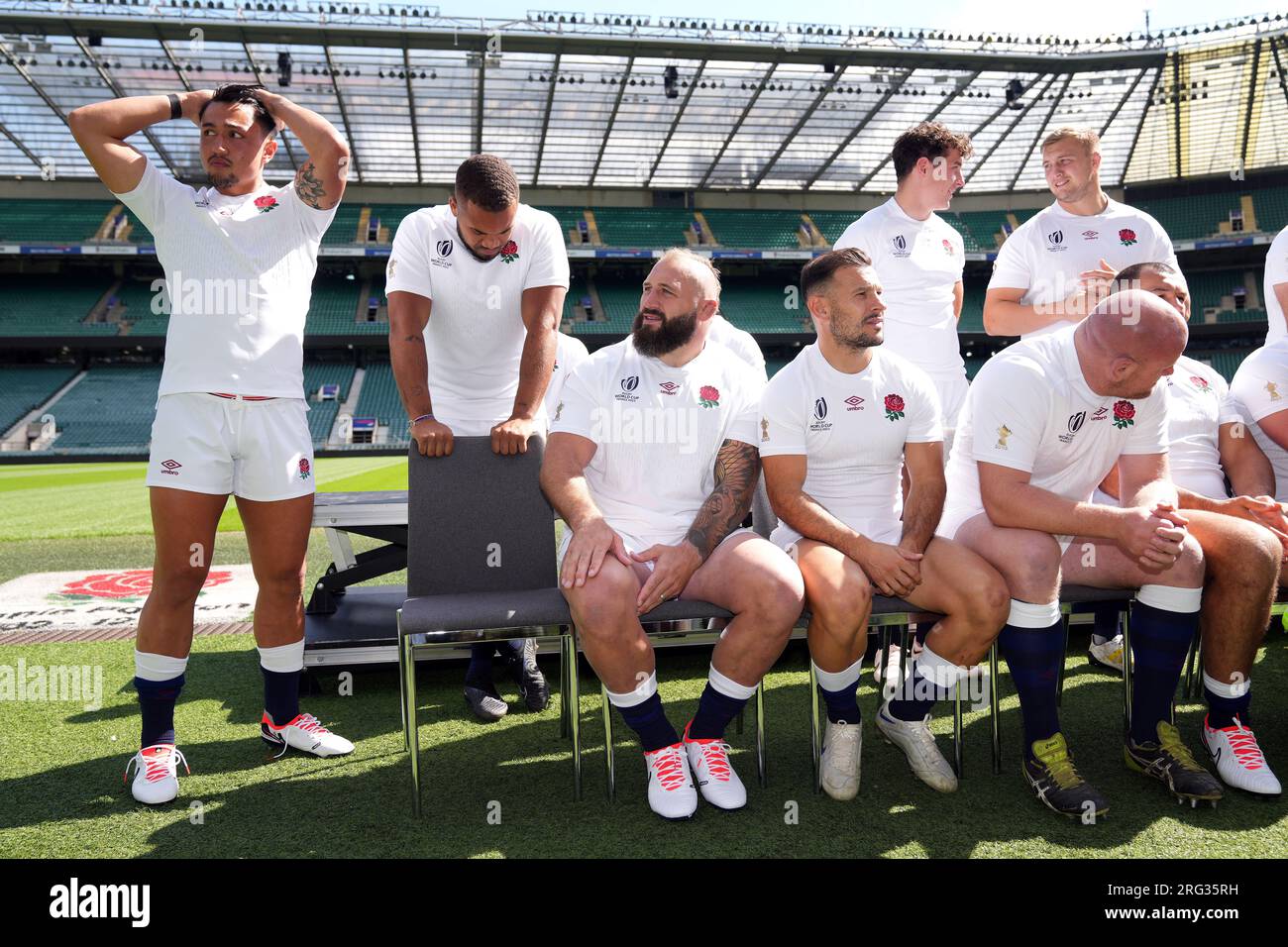 England's Marcus Smith (left) pushes his hair back while awaiting a ...