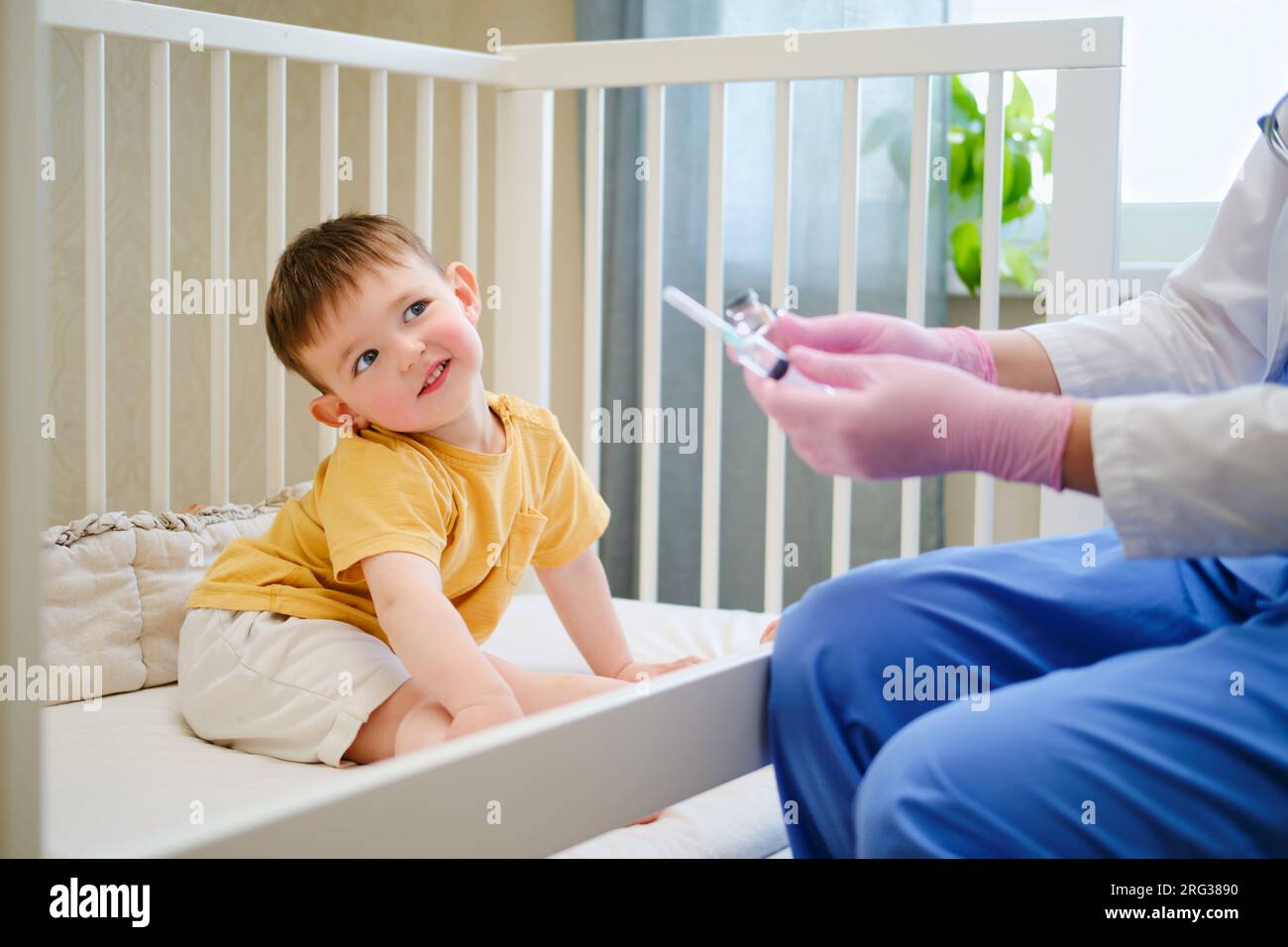 The doctor is preparing the syringe for the injection of the vaccine ...