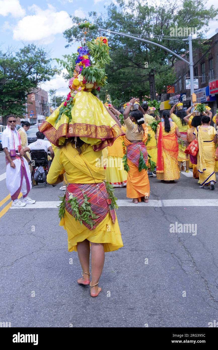 A pandita preistess marches from her temple to the site of the Thimithi ...