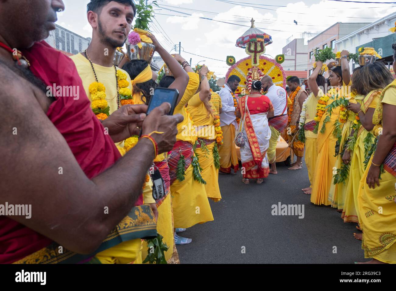 During their march from temple to fire walking grounds, devout Hindus ...