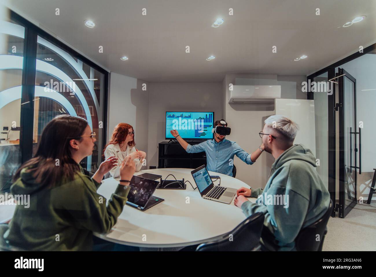 A diverse group of businessmen collaborates and tests a new virtual ...