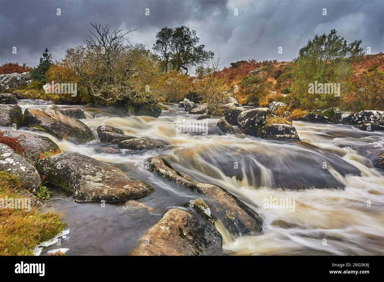 The waters of a moorland river tumbling downhill in an autumnal ...
