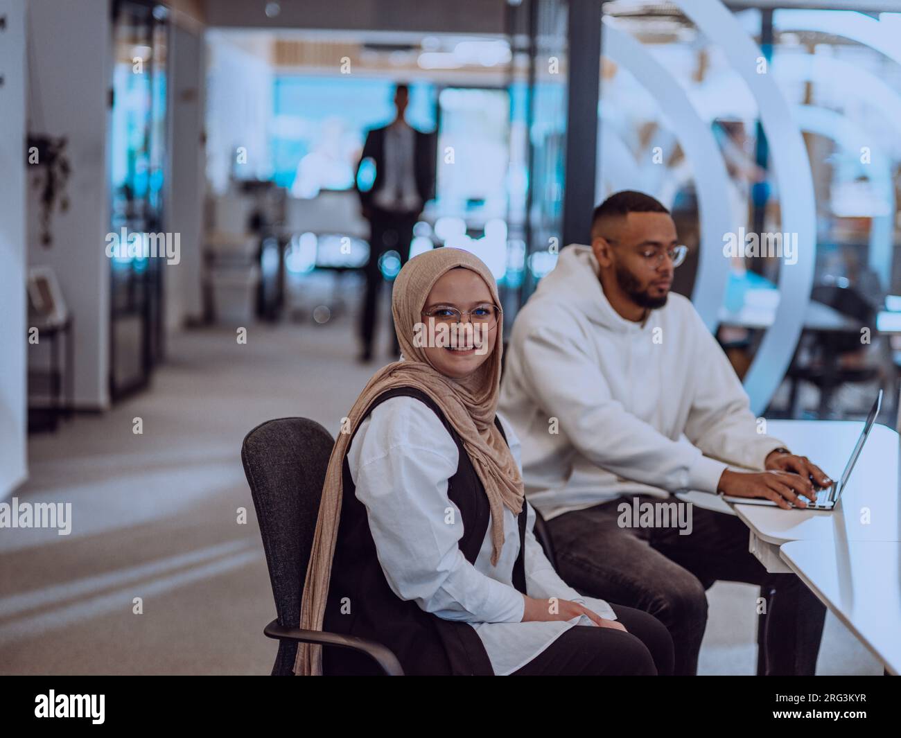 In a modern office setting, an African American businessman and his ...