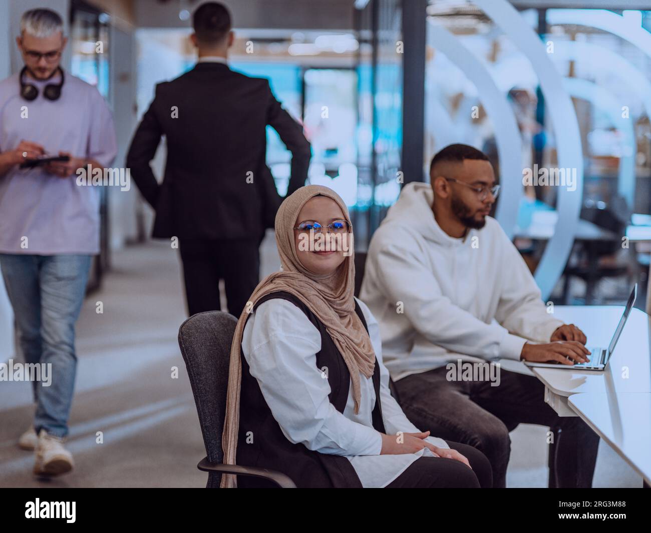 In a modern office setting, an African American businessman and his ...