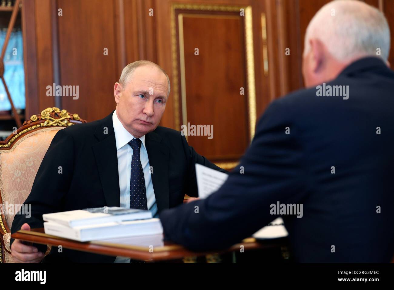 Russian President Vladimir Putin, left, listens to Rostec CEO Sergey ...