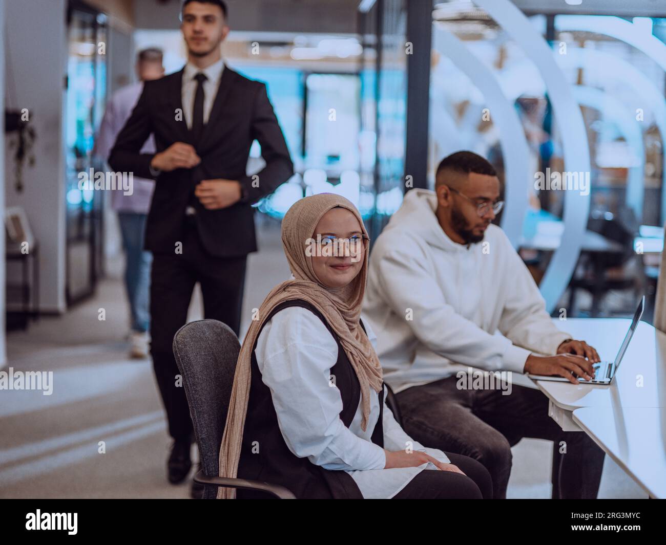 In a modern office setting, an African American businessman and his ...