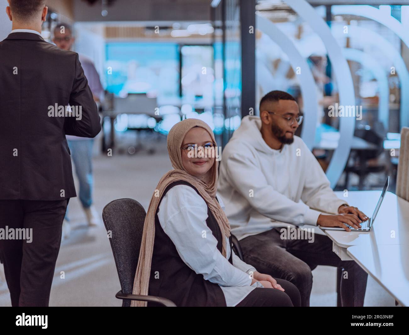 In a modern office setting, an African American businessman and his ...