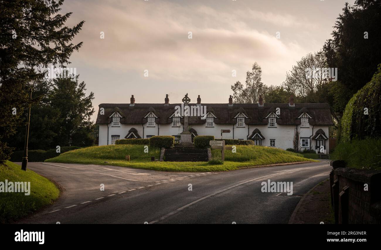 Victorian thatched cottages and the War Memorial in Warter, East ...