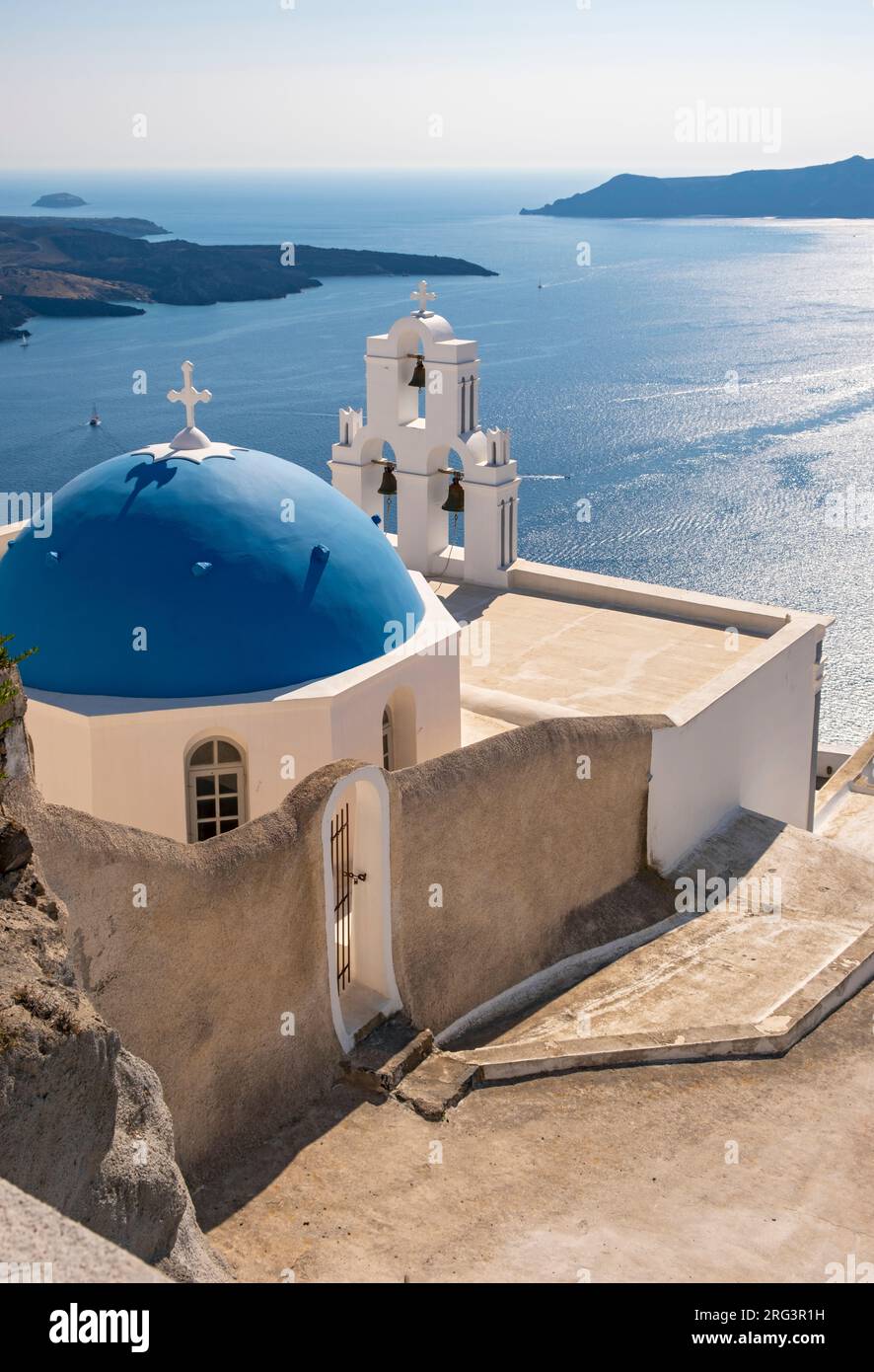 Iconic blue-domed church and Three-bells of Fira belfry with sea view ...
