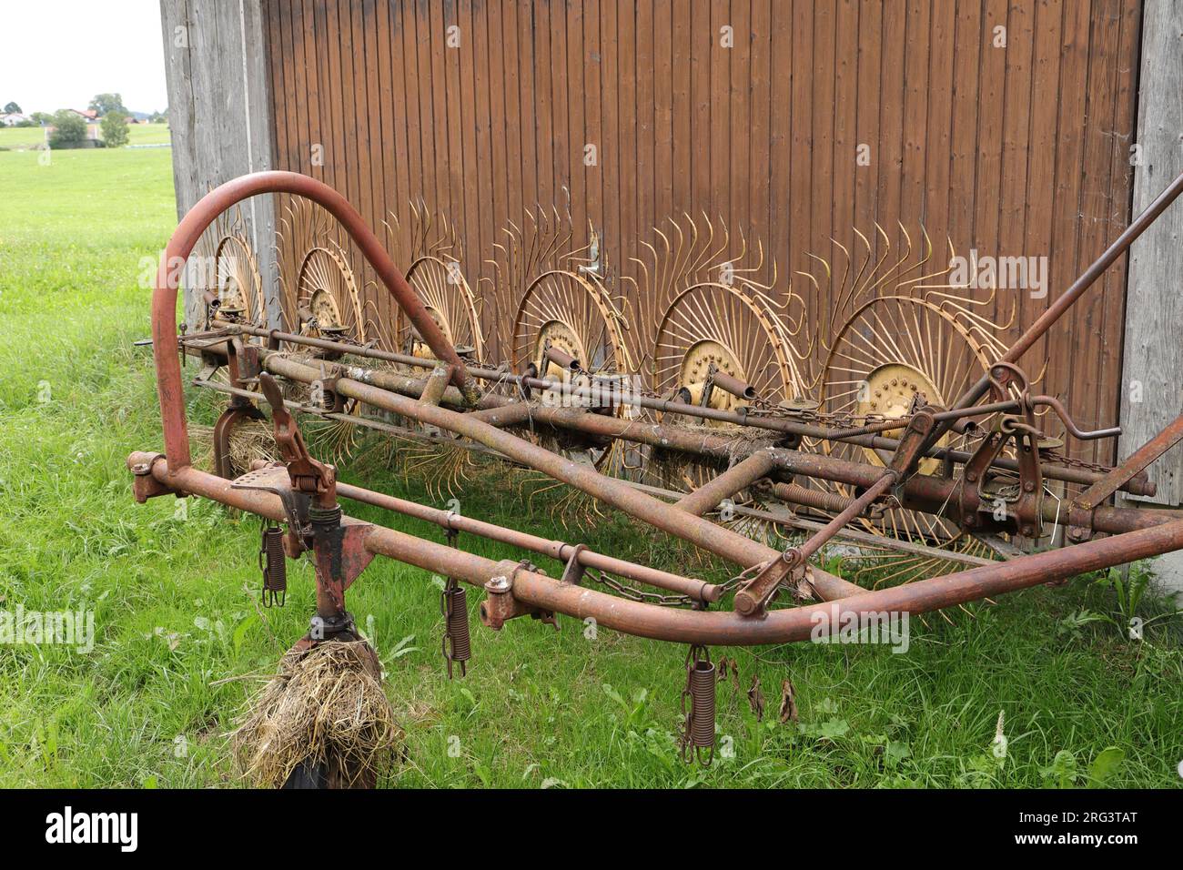 an old rusted historic hay tedder Stock Photo - Alamy