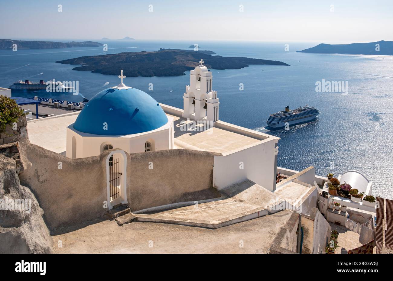 Iconic blue-domed church and belfry (Three Bells of Fira) with Costa ...