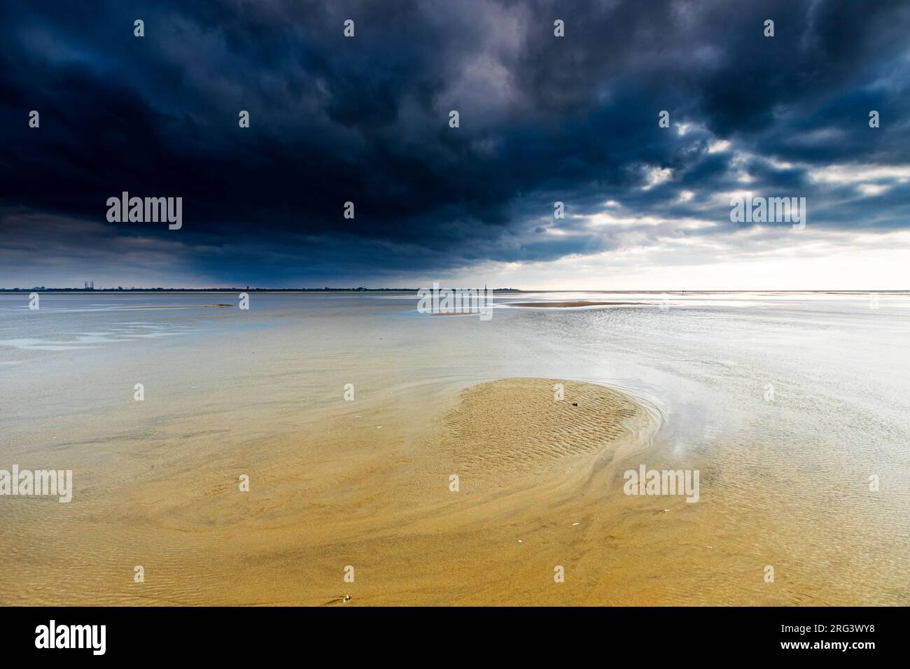 Thunderclouds over the beach of Texel Stock Photo - Alamy