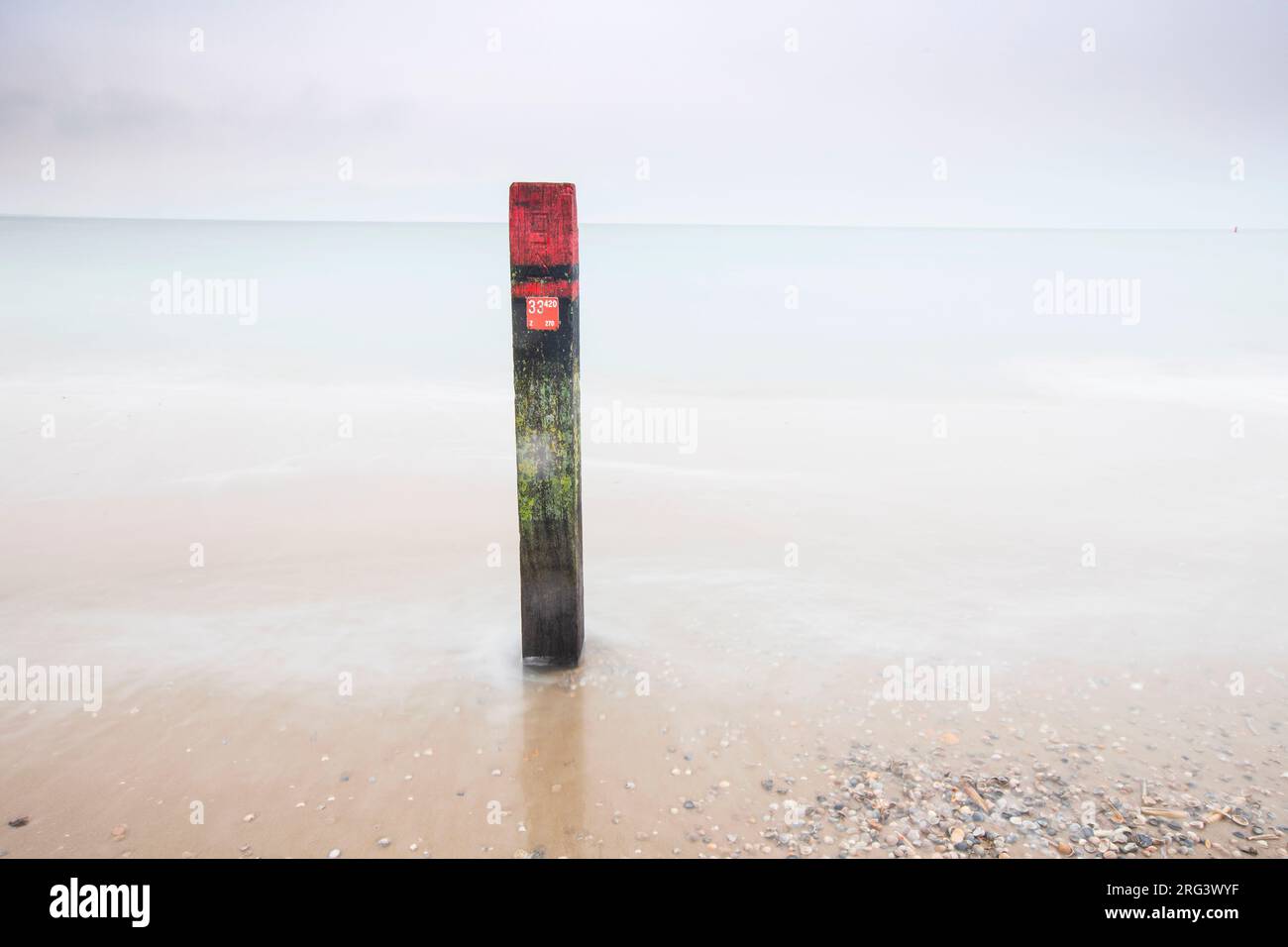 Pole on the beach of Texel Stock Photo - Alamy