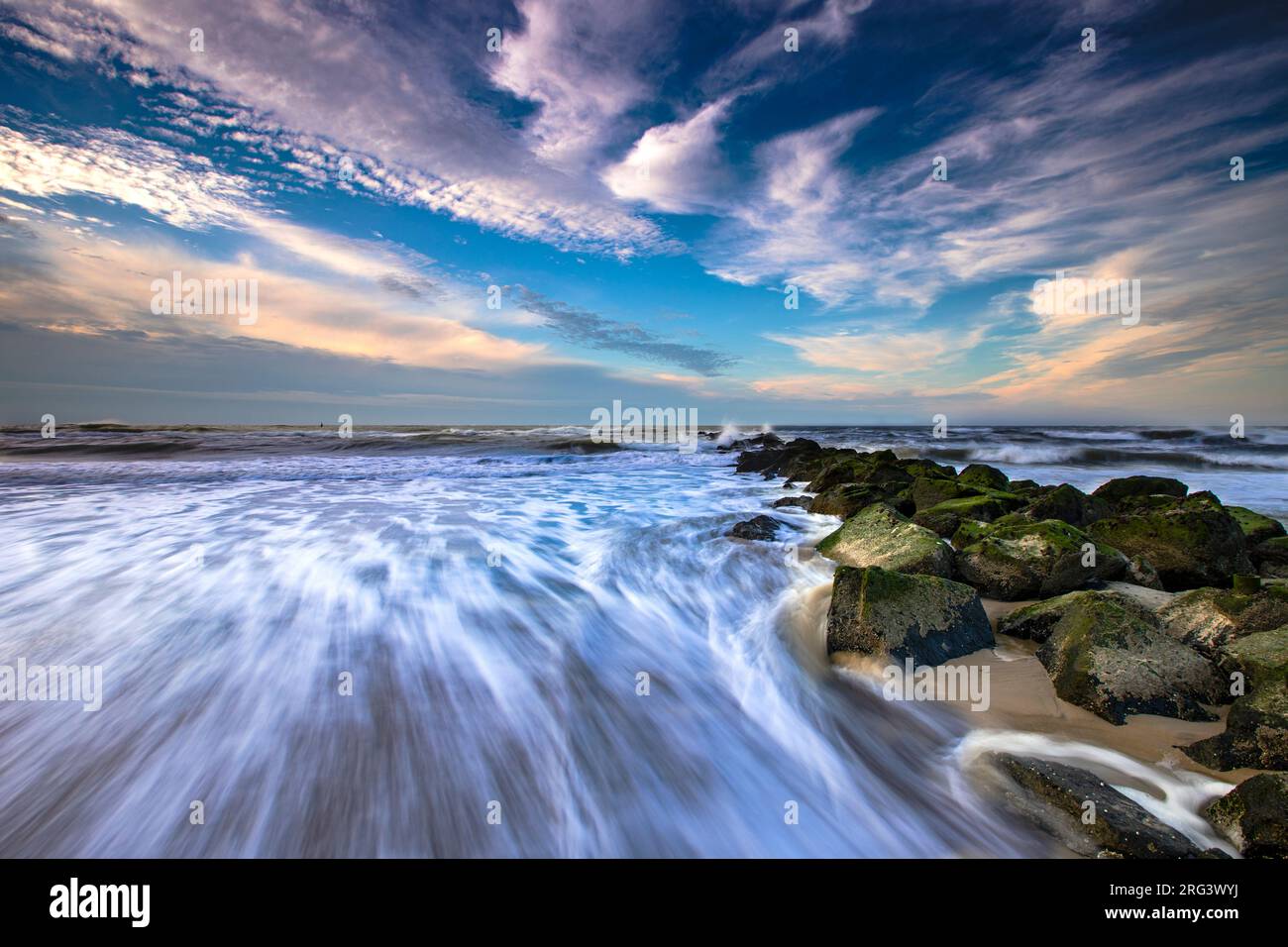 Coastal defense by breakwaters to prevent erosion Stock Photo - Alamy