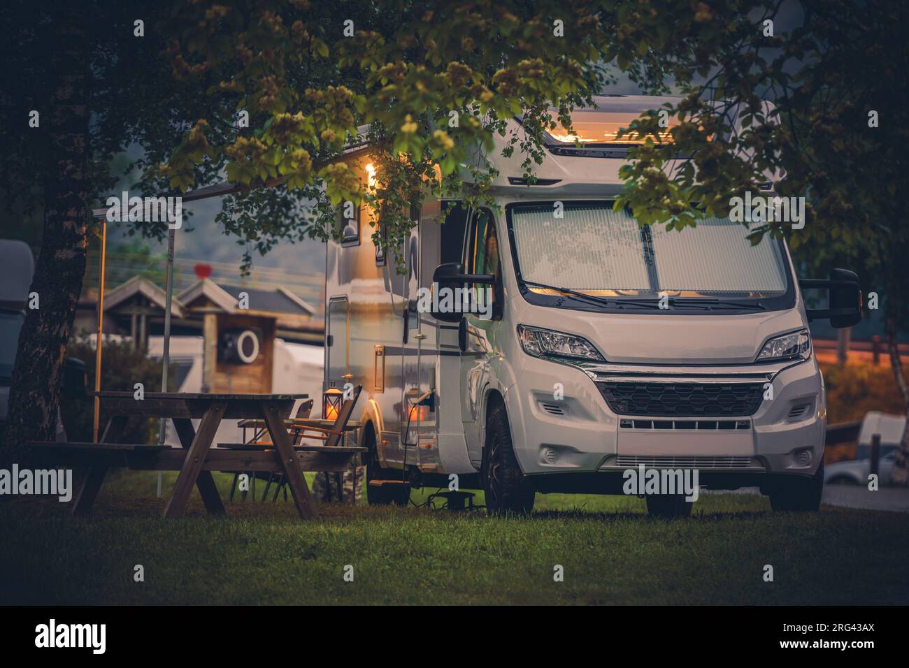 Modern RV Camper Van and a Camping Spot. Recreational Vehicle Road Trip ...