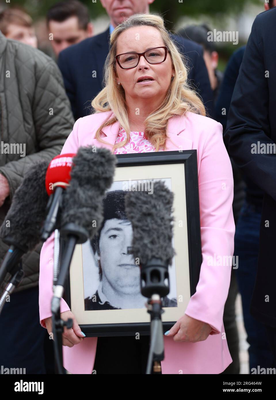 Davina Bolton holding an image of her brother Phelim McNally, joins ...