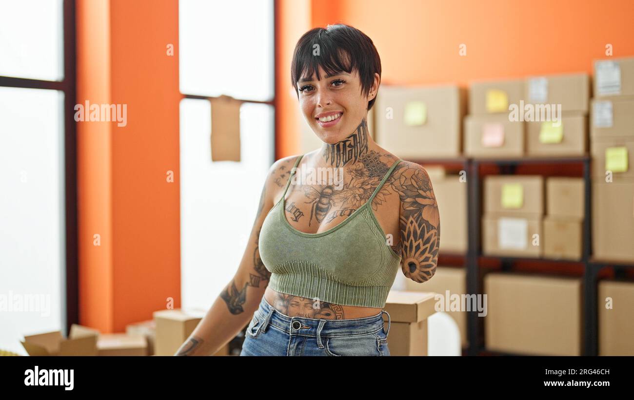 Hispanic woman with amputee arm ecommerce business worker smiling ...
