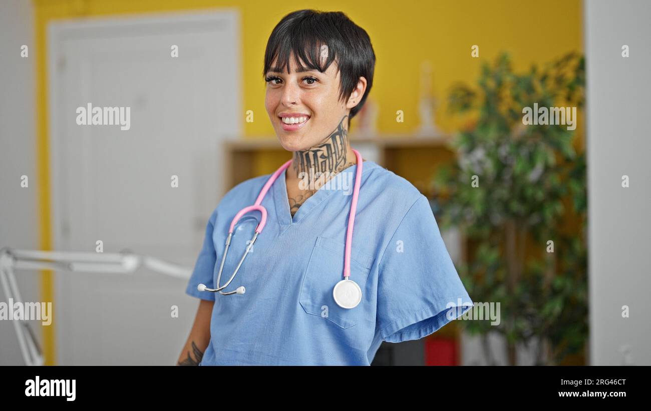 Hispanic woman with amputee arm doctor smiling confident standing at ...