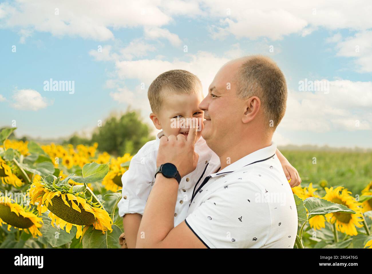 Father's day concept. Family. A little boy in his father's arms ...