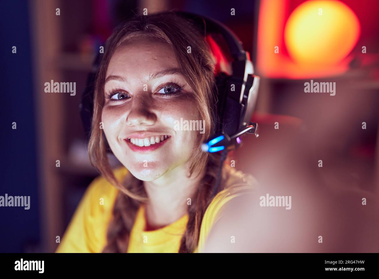 Young blonde woman streamer smiling confident make selfie by camera at ...