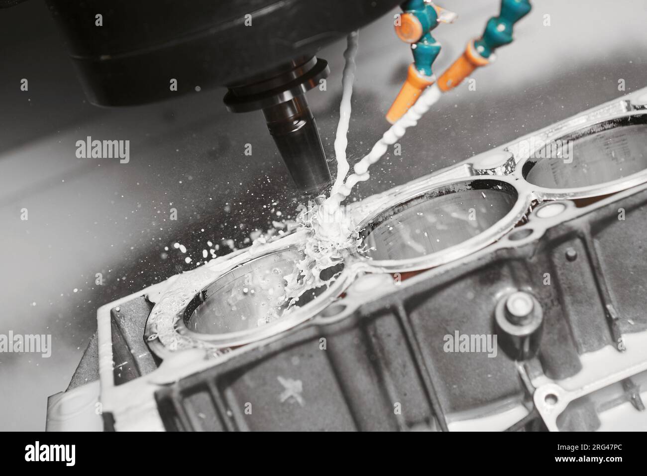 High precision cnc milling machine makes holes in the car engine Stock ...