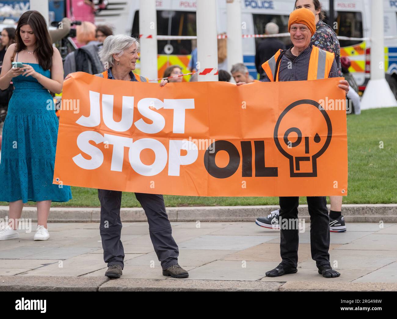 Just Stop Oil activists holding large banner in central London ...