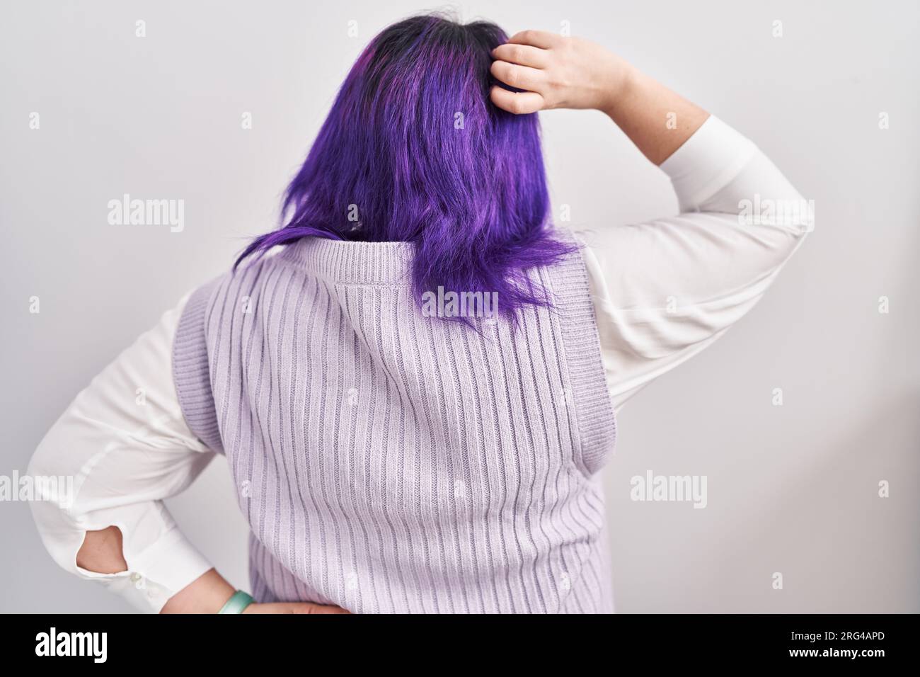 Plus size woman wit purple hair standing over white background ...