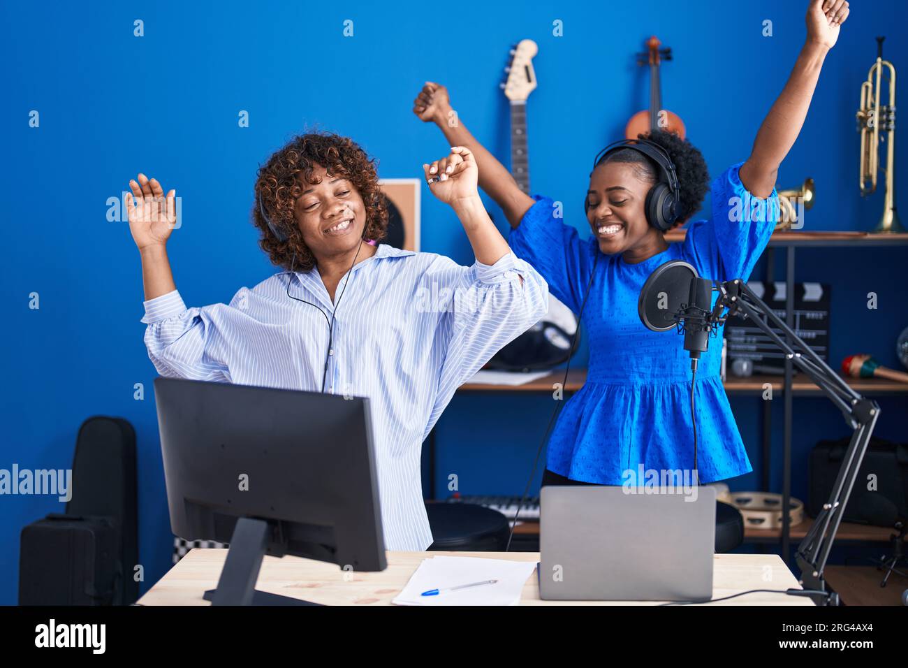 African american women musicians smiling confident dancing at music ...