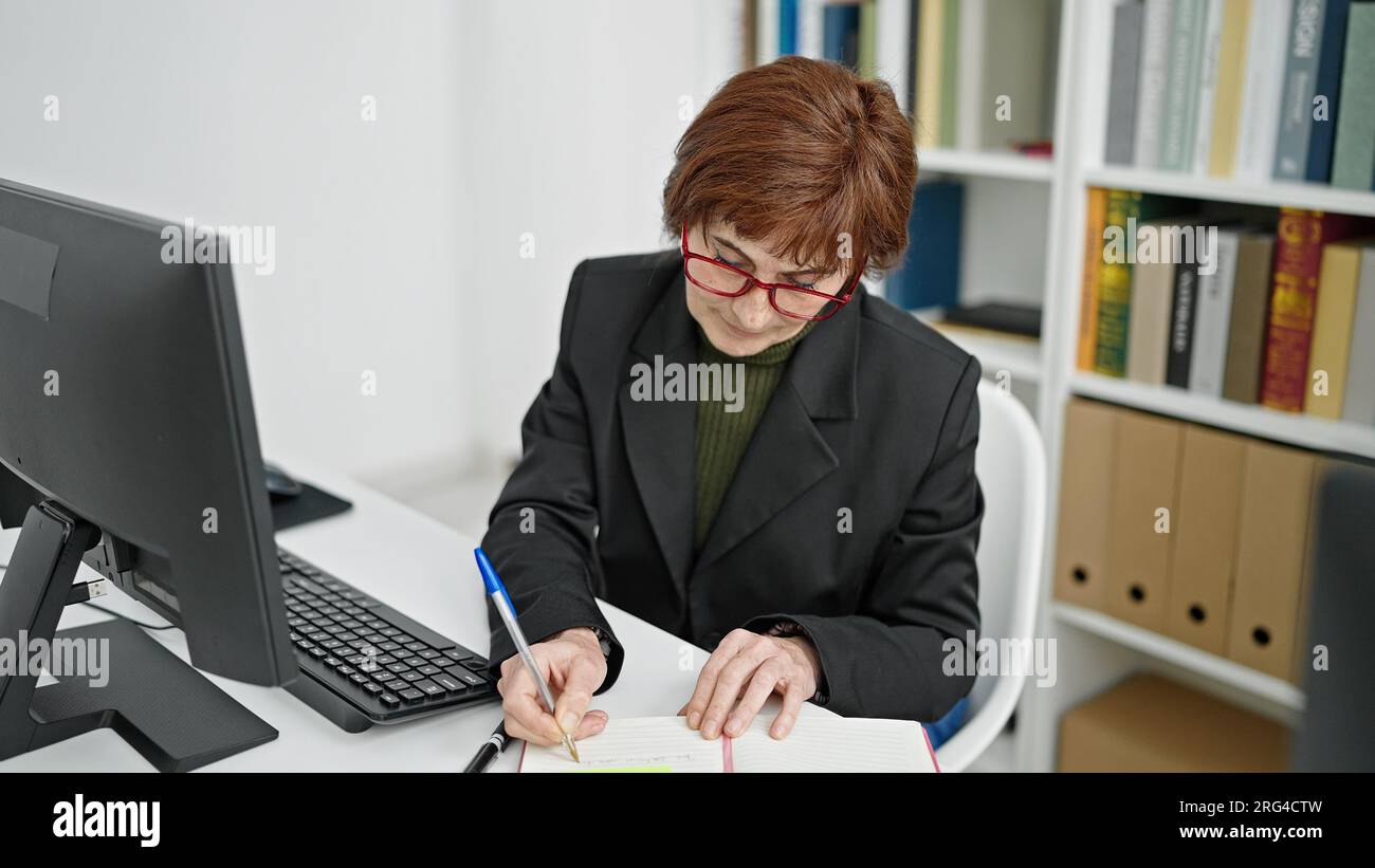 Mature hispanic woman teacher using hi-res stock photography and images ...