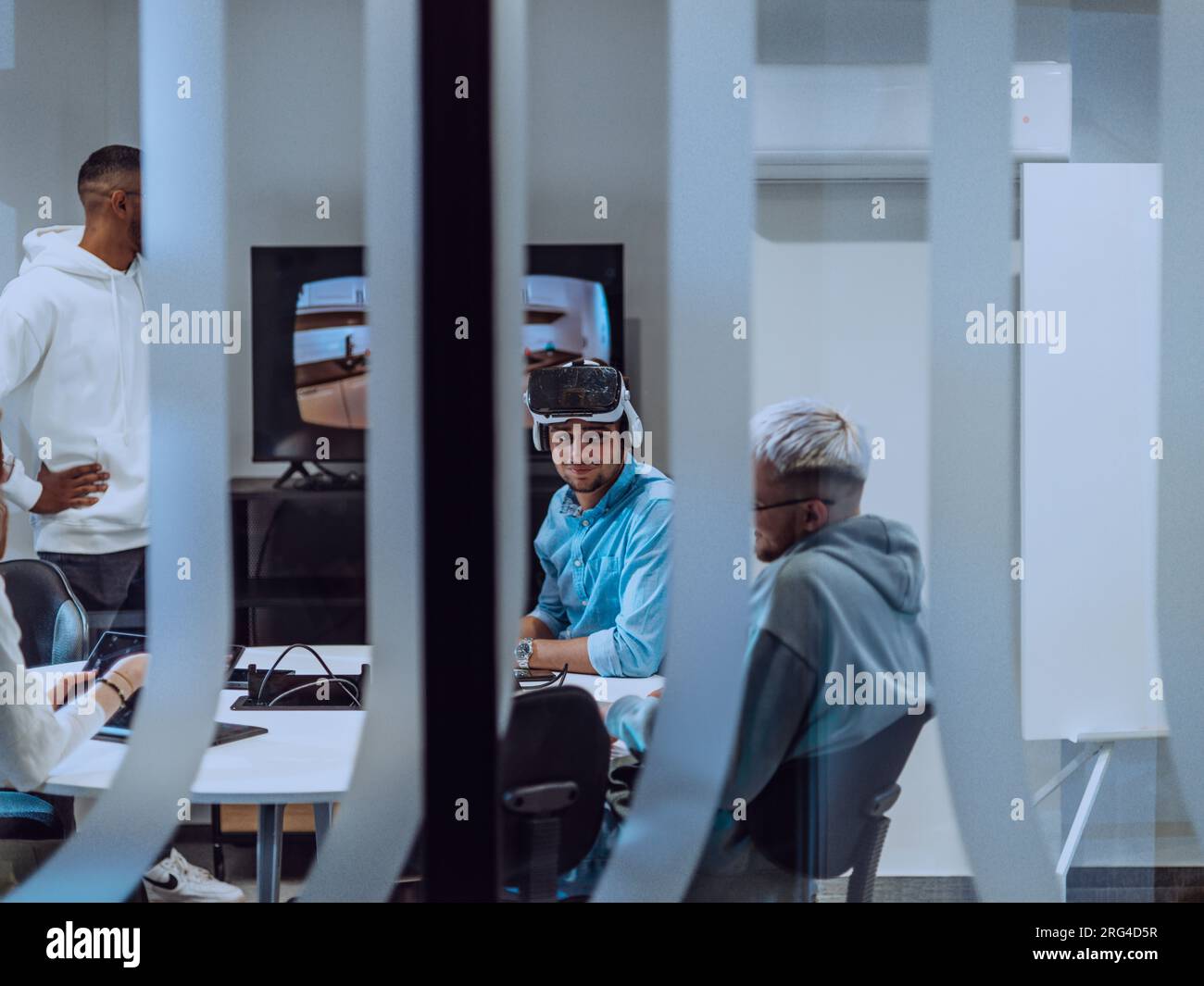 A diverse group of businessmen collaborates and tests a new virtual ...