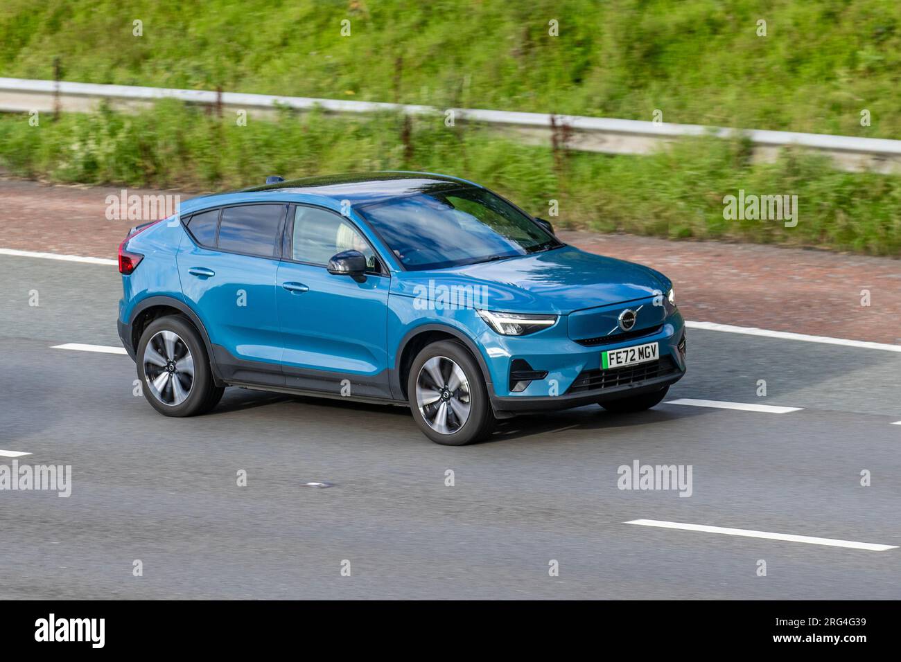 2022 Blue Volvo C40 Core Recharge EV; travelling at speed on the M6 ...