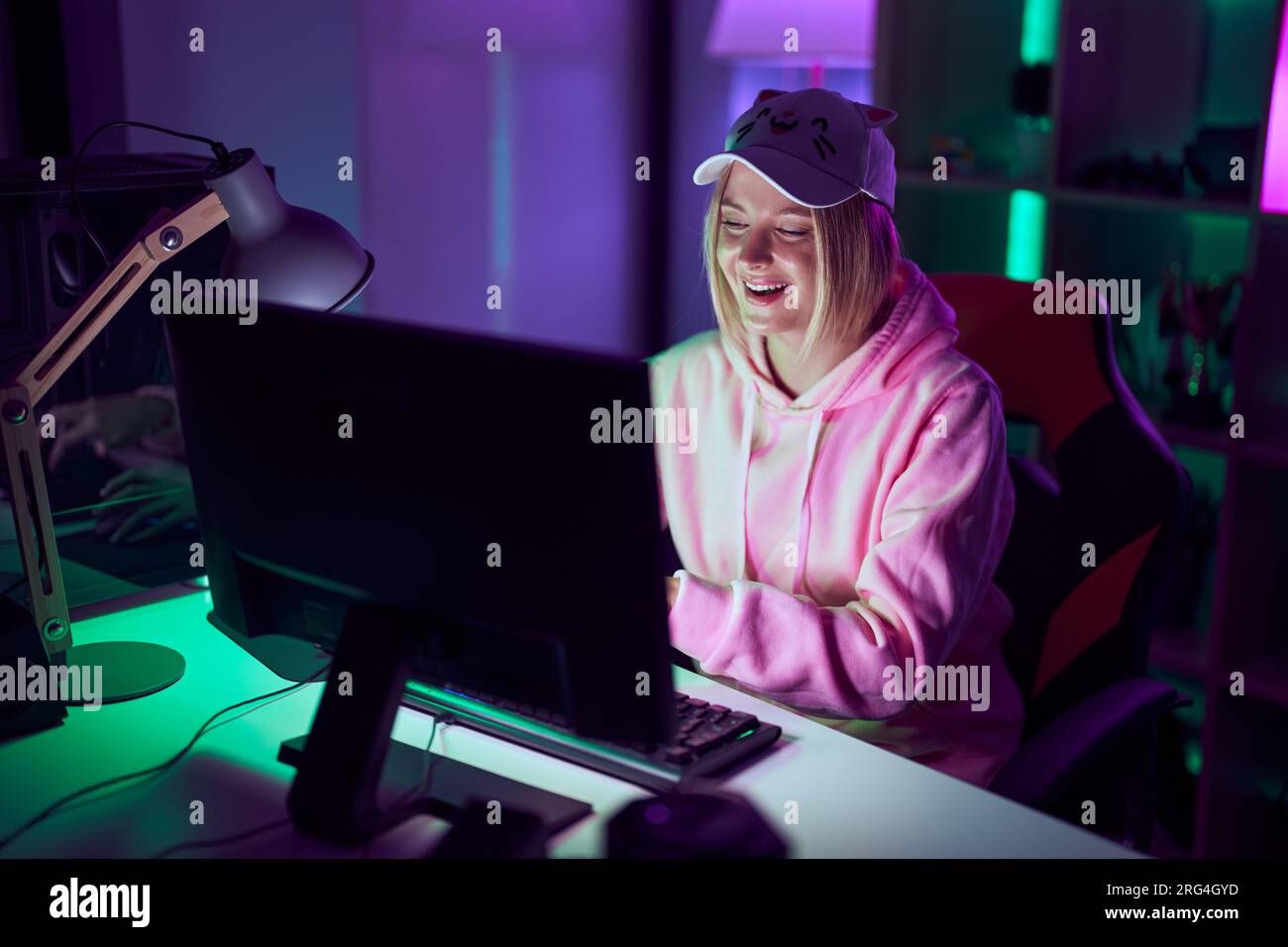 Young blonde woman streamer using computer at gaming room Stock Photo ...
