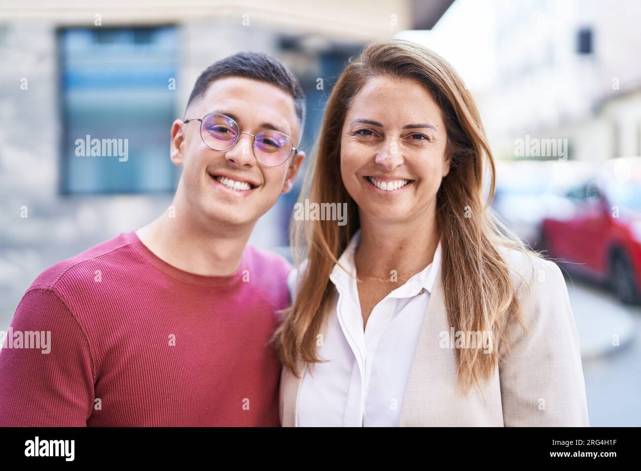Man and woman mother and son standing together at street Stock Photo ...