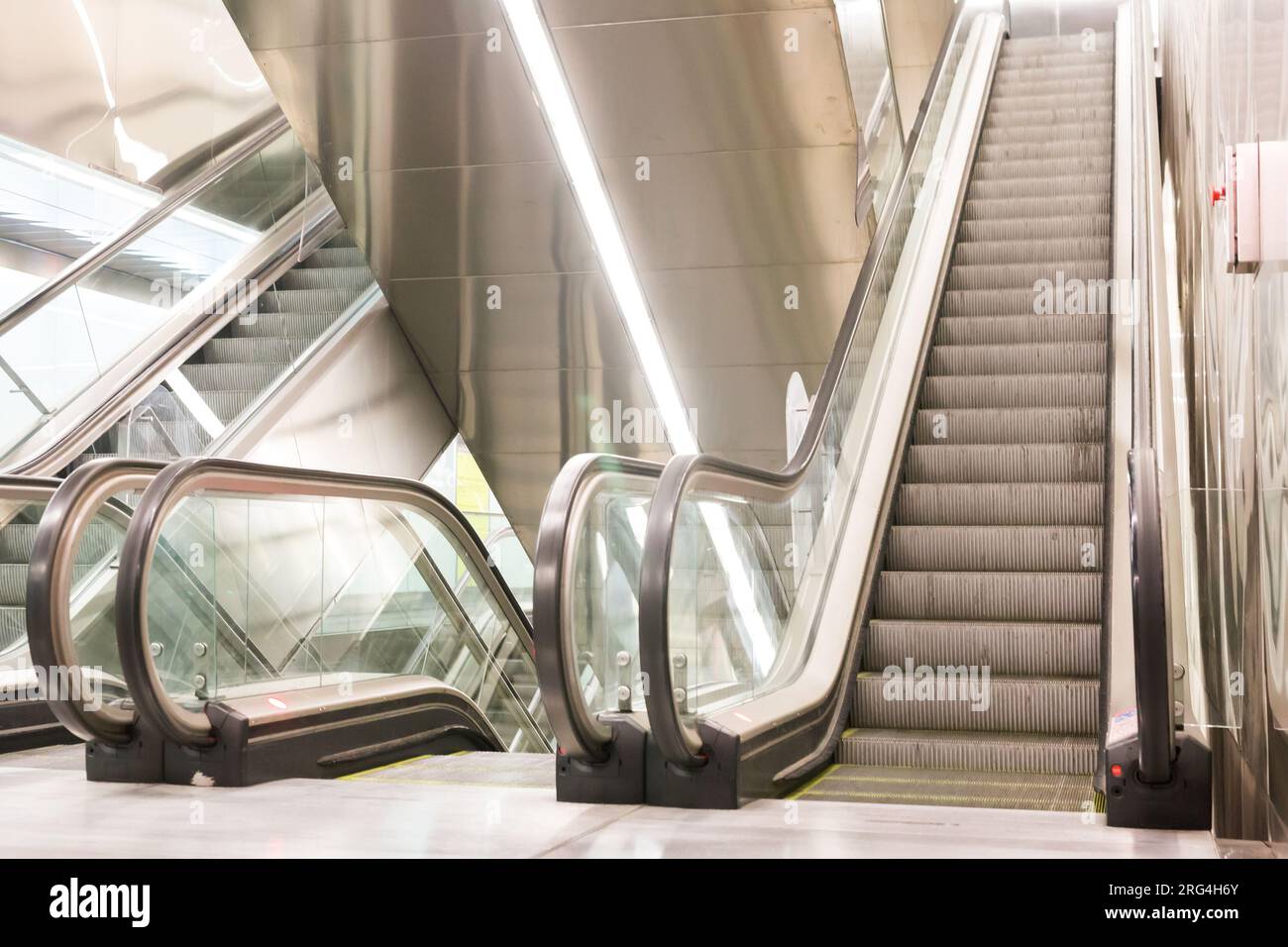 Line escalators with metal coating Stock Photo - Alamy