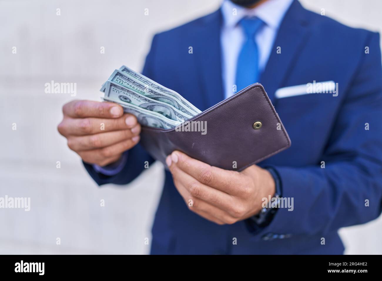 Handsome man counting money over hi-res stock photography and images ...