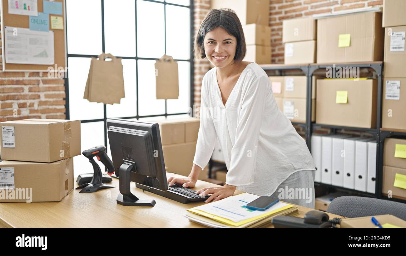Young beautiful hispanic woman ecommerce business worker smiling ...