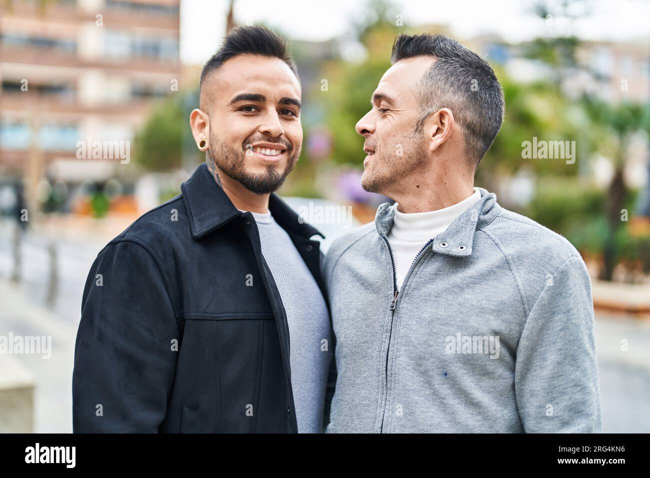 Two men couple smiling confident standing together at street Stock ...