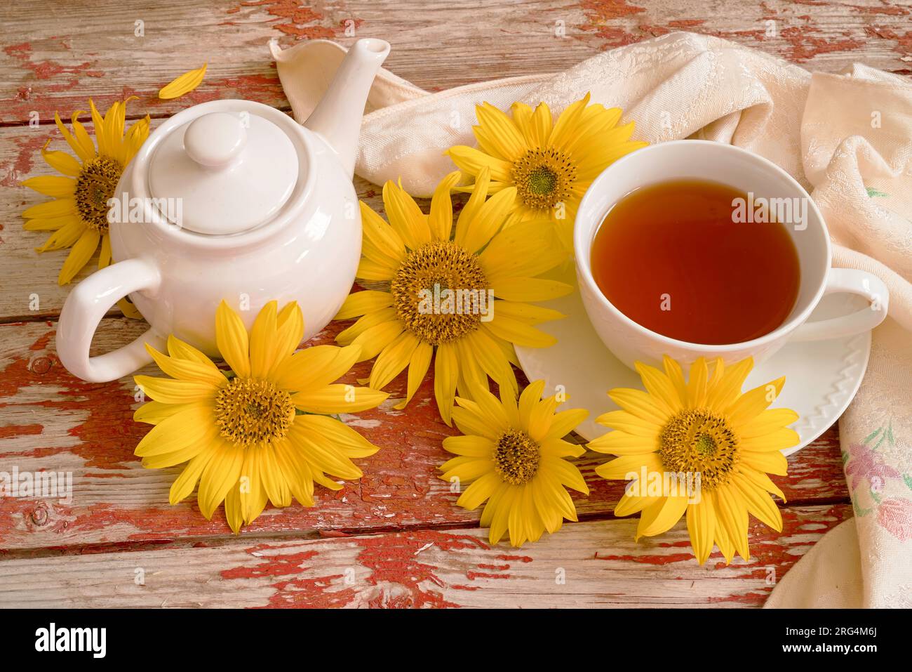 Tea cup and teapot on a rustic background with sunflowers Stock Photo ...