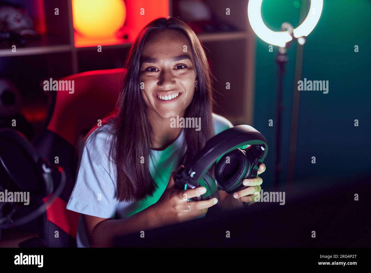 Young beautiful hispanic woman streamer smiling confident holding ...