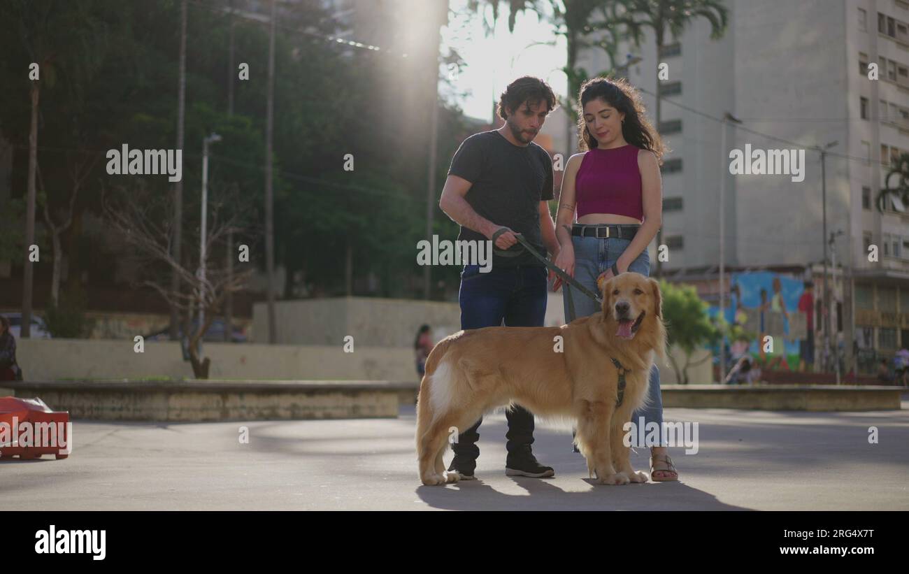 Couple in city A Candid Outdoor Millennials with their Beloved Purebred ...