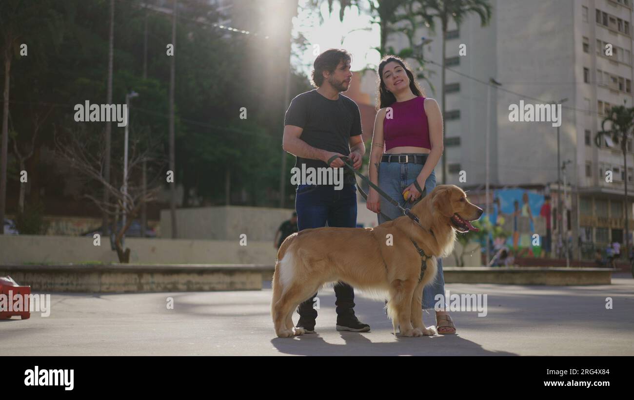 Couple in city A Candid Outdoor Millennials with their Beloved Purebred ...
