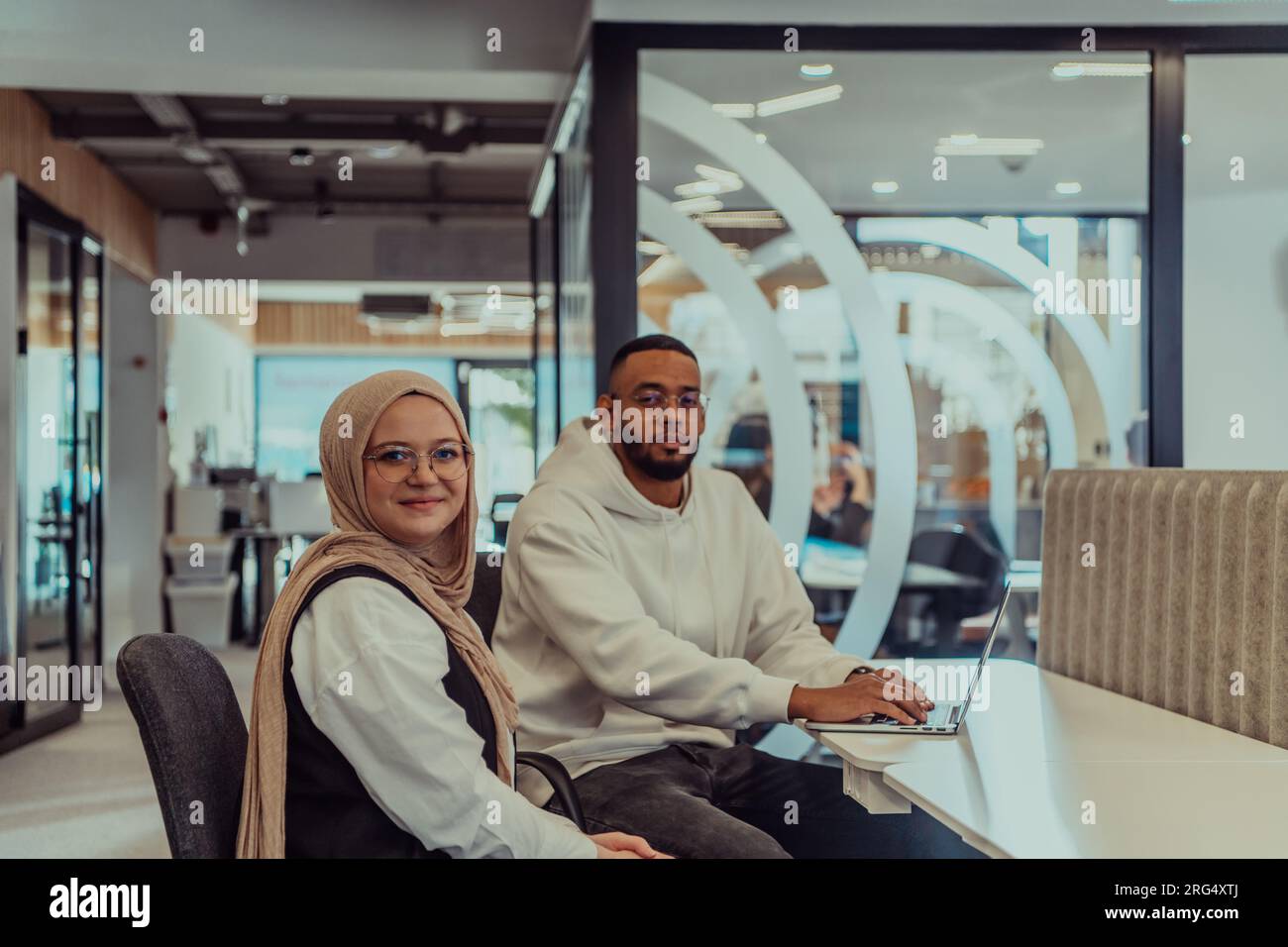 In a modern office setting, an African American businessman and his ...