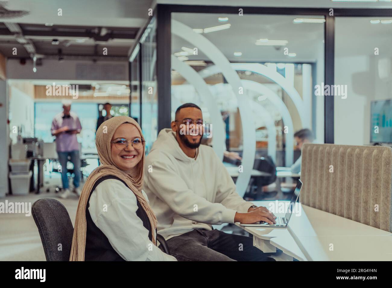 In a modern office setting, an African American businessman and his ...