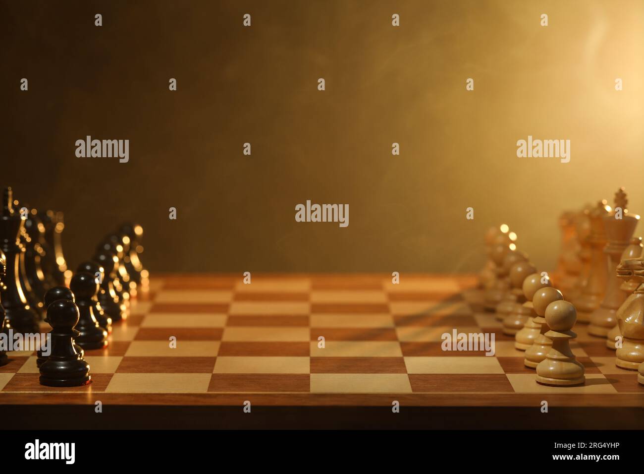 Black and white chess pieces on checkerboard before game. Space for ...