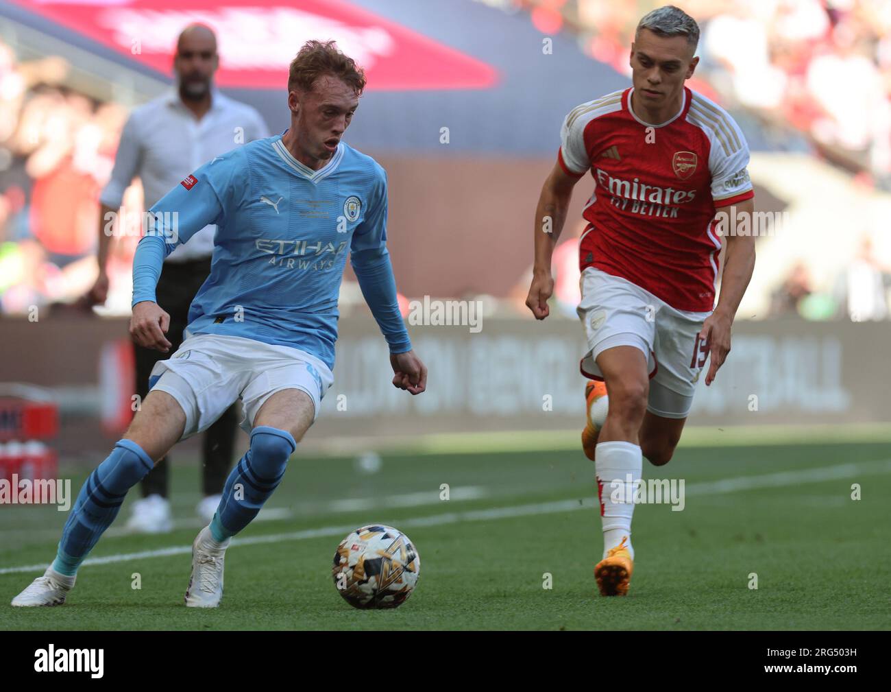 Manchester City's Cole Palmer holds of Leandro Trossard of Arsenal ...