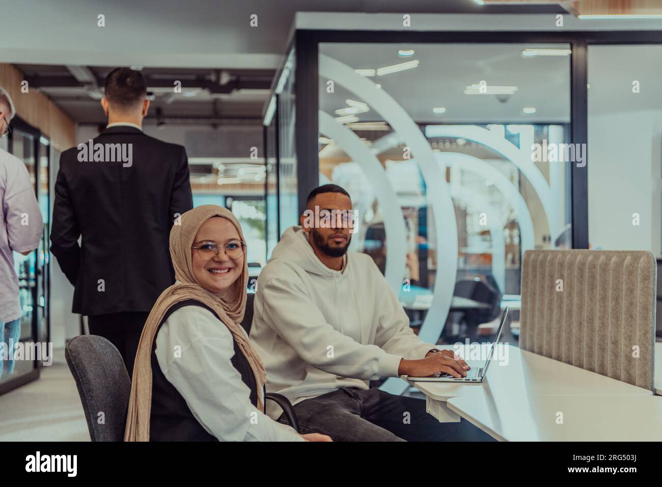 In a modern office setting, an African American businessman and his ...