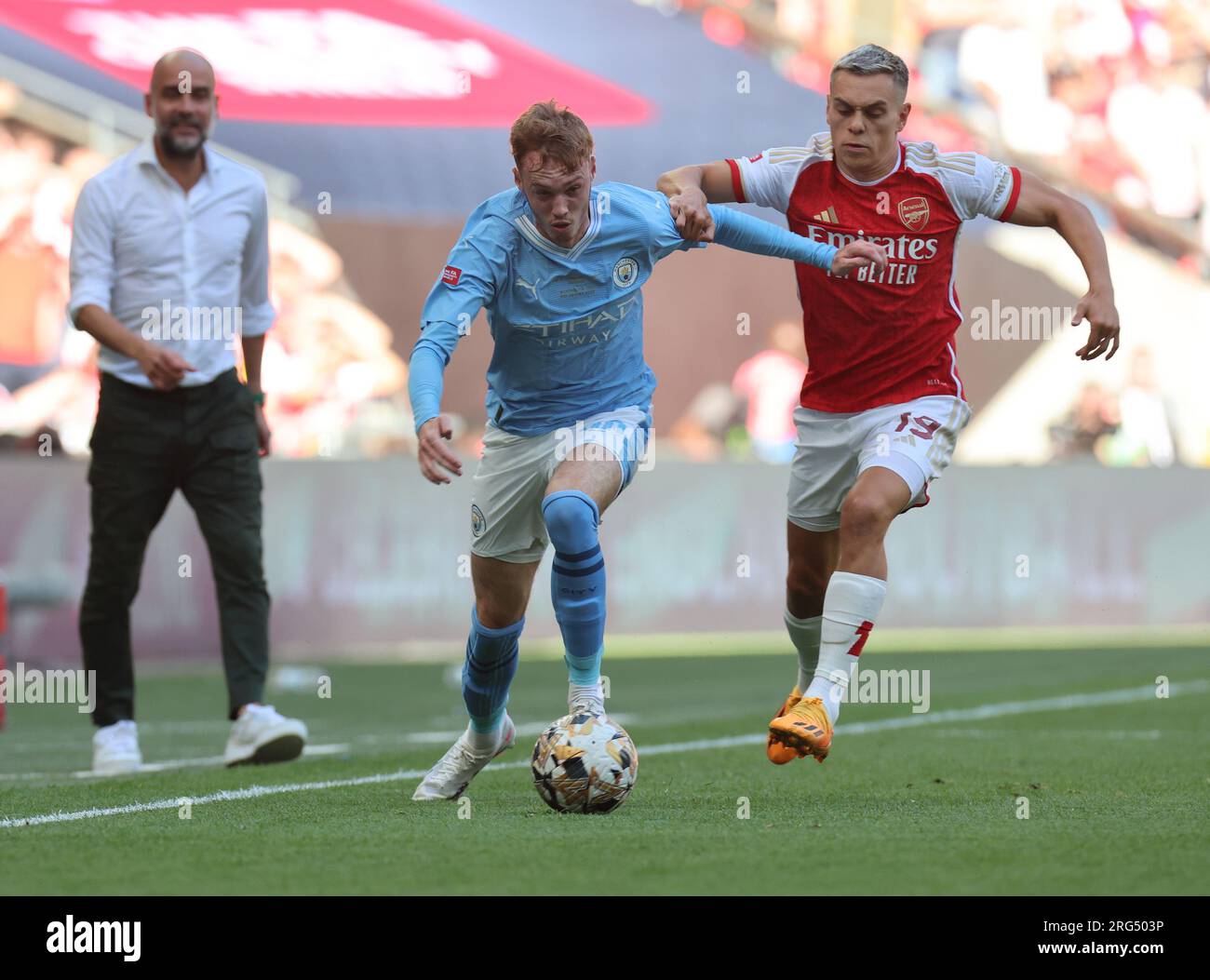 Manchester City's Cole Palmer holds of Leandro Trossard of Arsenal ...