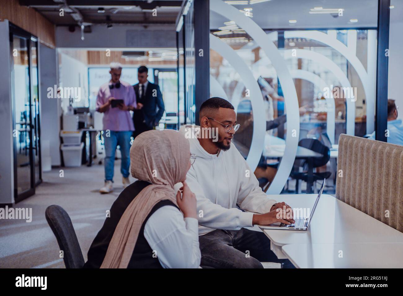 In a modern office setting, an African American businessman and his ...