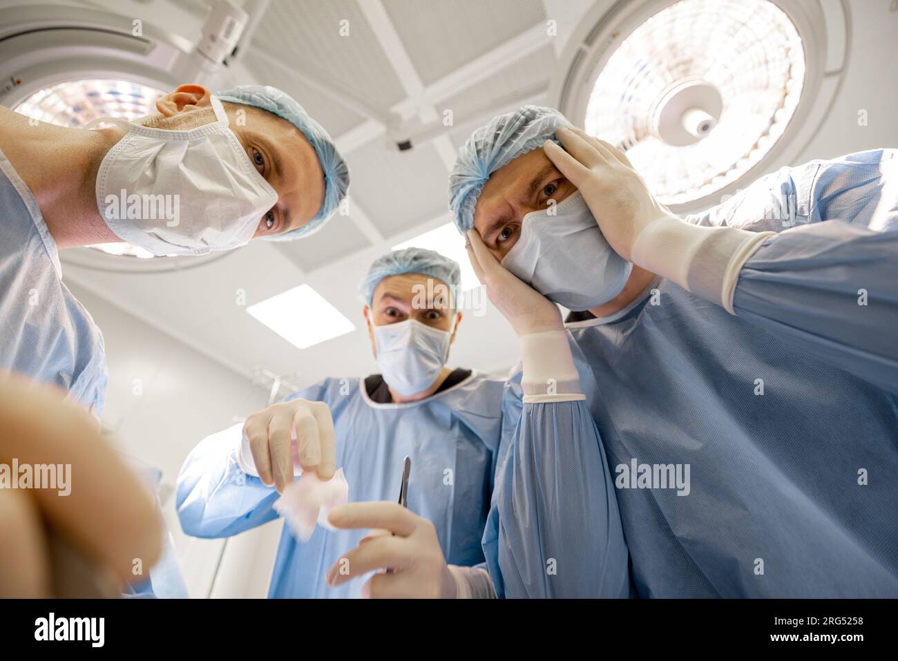 Scary surgeons look at the place of surgical interventio Stock Photo ...