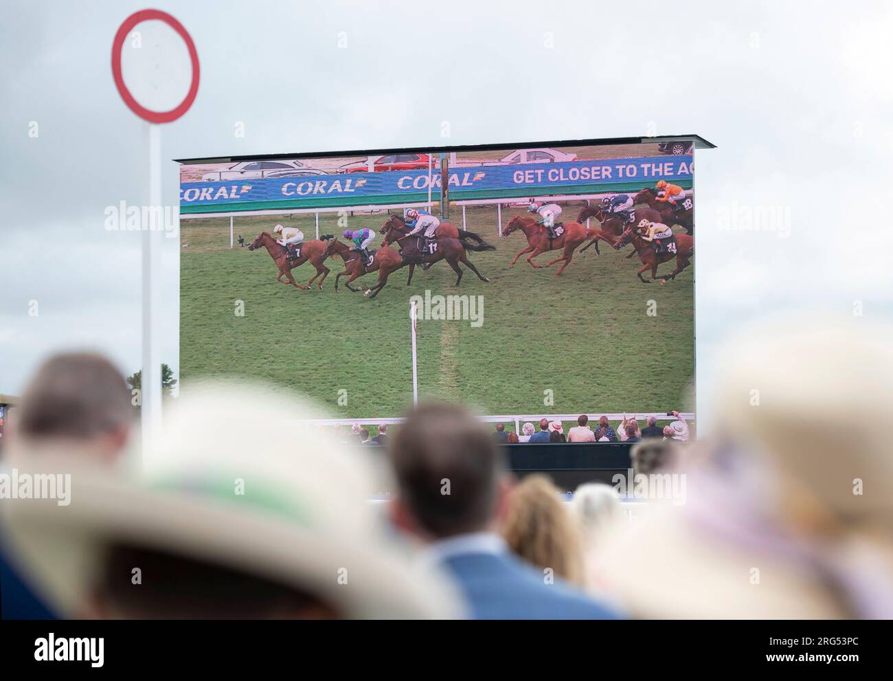 Spectators watching the action on a big screen at the Qatar Goodwood ...